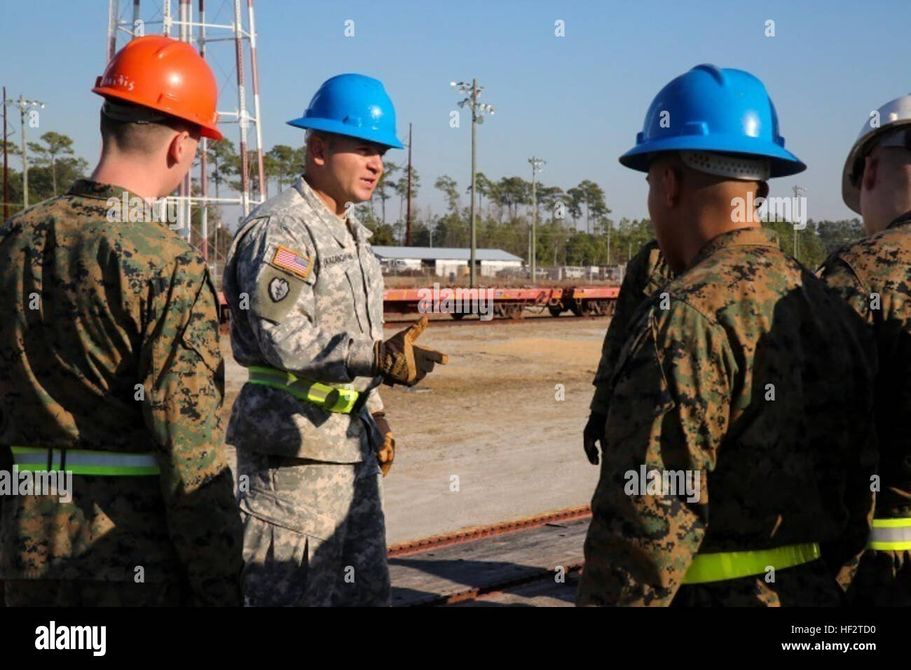 Army Sgt. 1st Class Grachya Kazanchyan (center), the rail ...