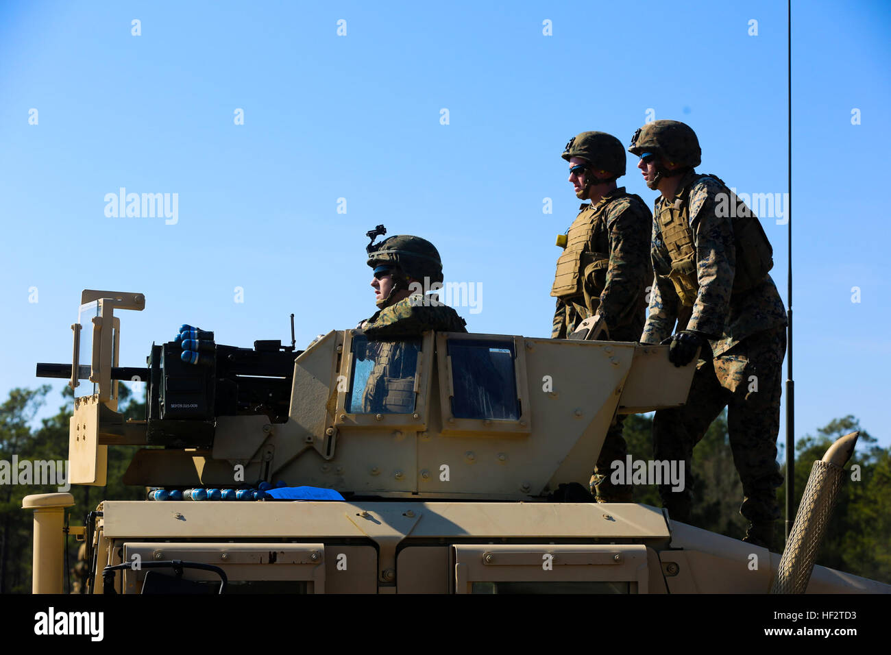 Marines with Scout Platoon, 2nd Tank Battalion prepare to fire a Mk 19 ...