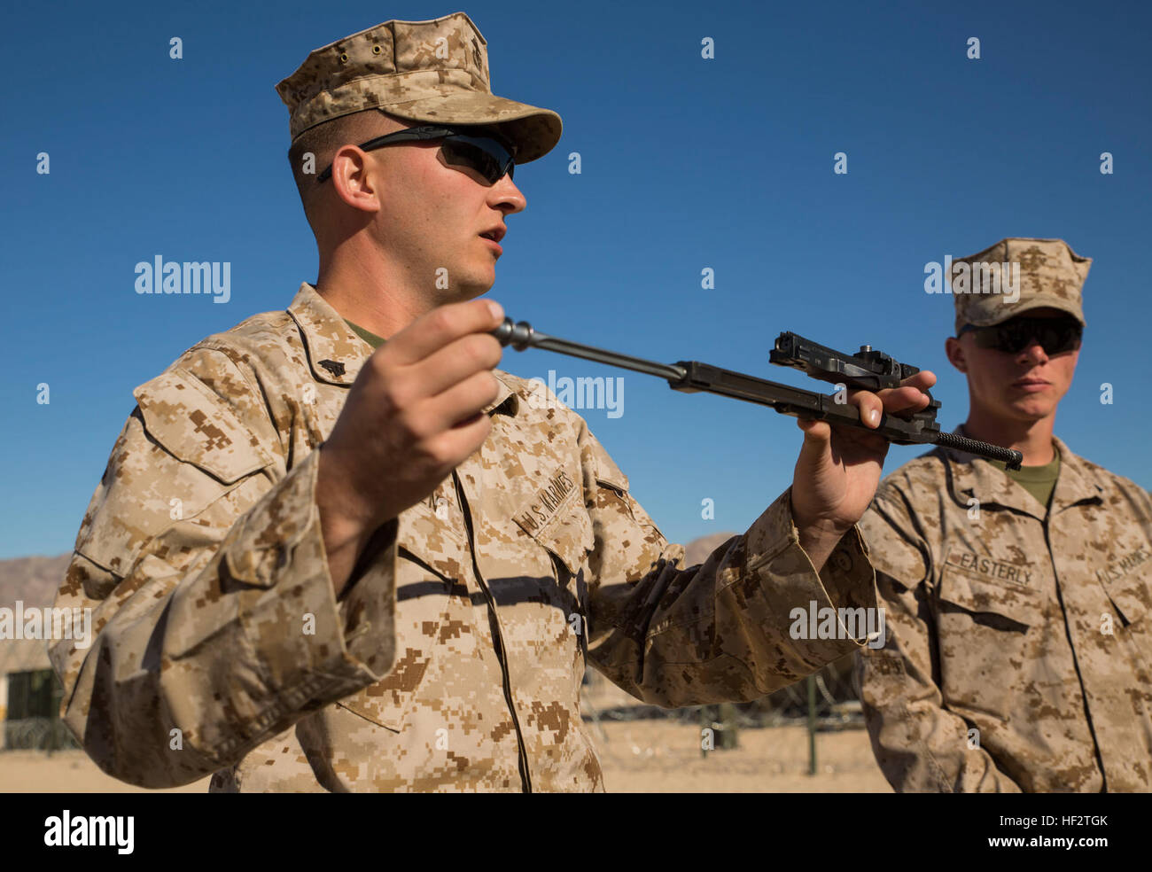 Sgt. Robert T. Larsen, left, explains how the bolt and operating rod ...