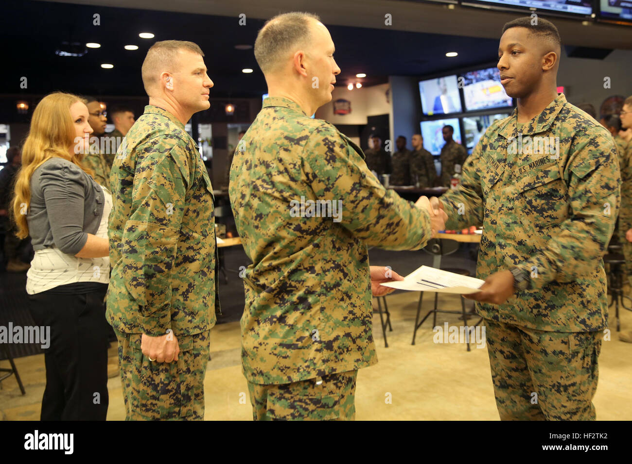 Col. Chris Pappas III, center, presents Lance Cpl. Jerell W. Pittman ...