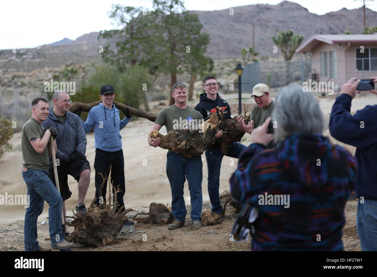 1st Tank Battalion Marines and sailors pose for a photo after helping ...
