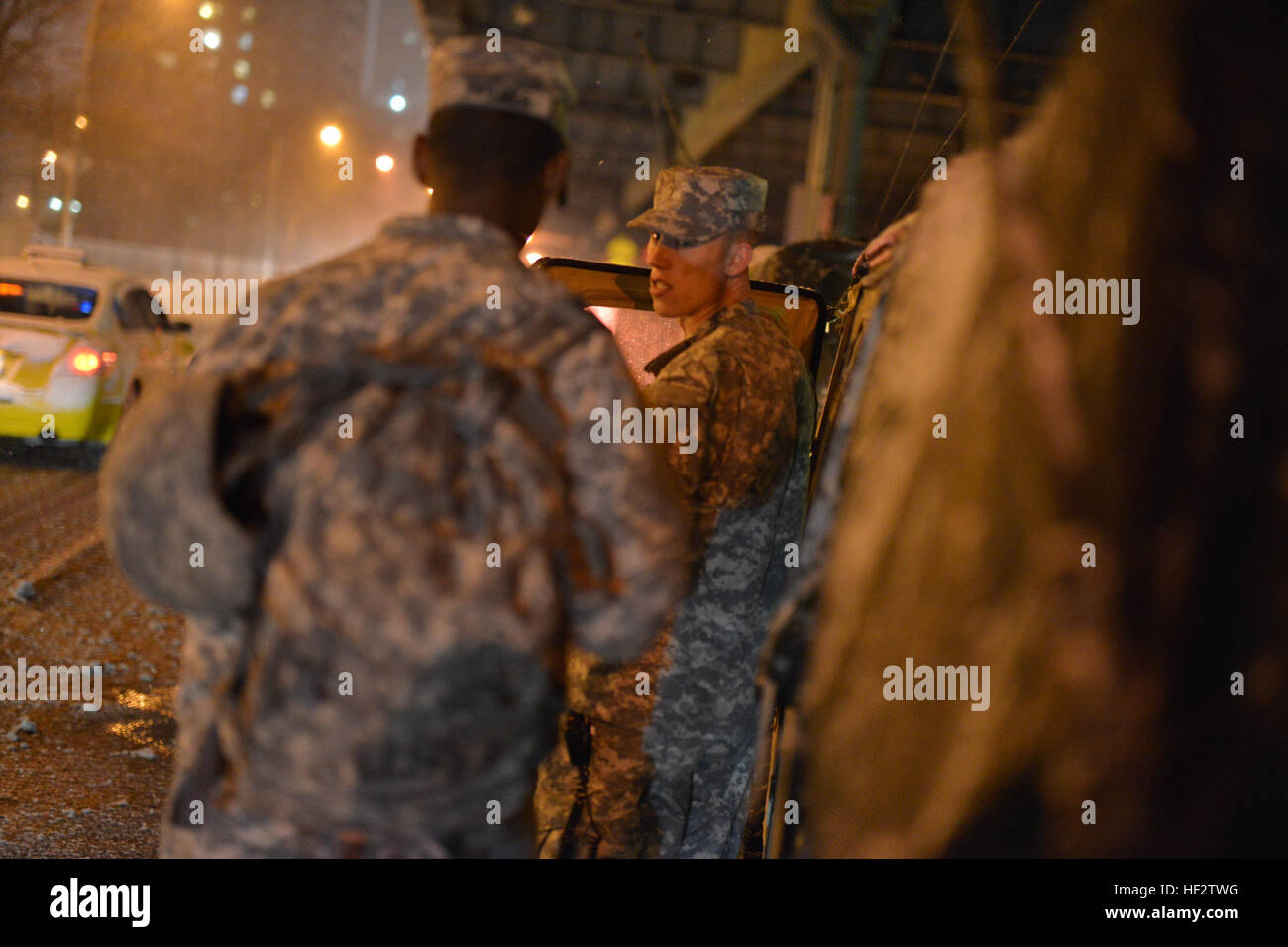 Soldiers with Joint Task Force Empire Shield work with members of the ...