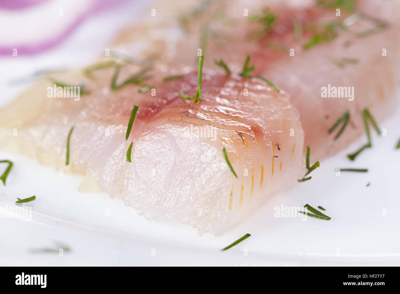 Fillet of a lightly salted grayling closeup Stock Photo - Alamy