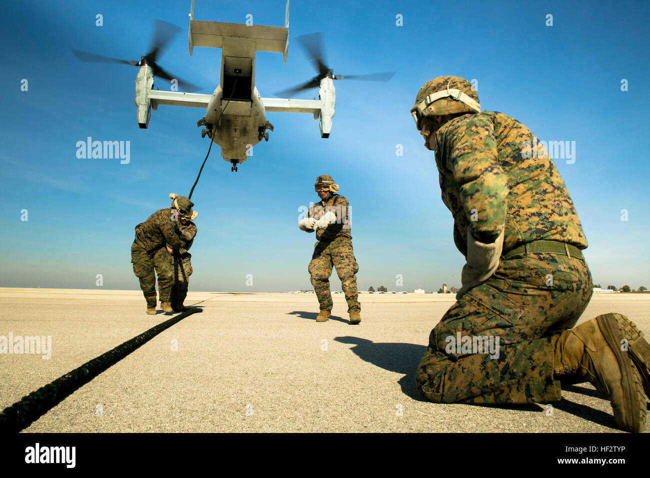 U.S. Marine Corps Sgt. Kevin Perez (center), a Helicopter Rope ...