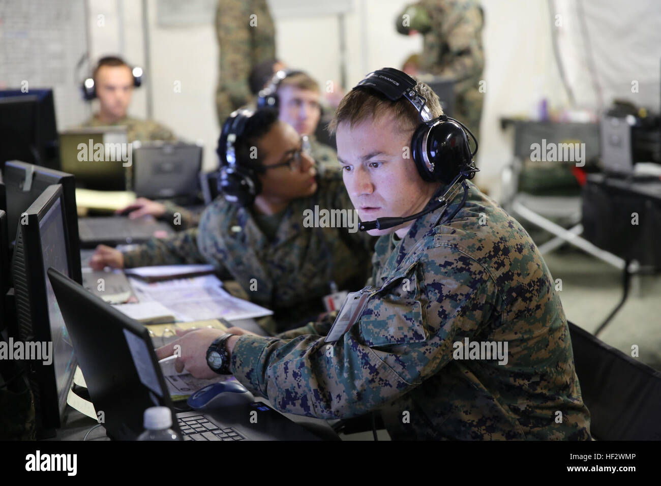 First Lt. Aaron Smith uses a computer inside Marine Air Support ...