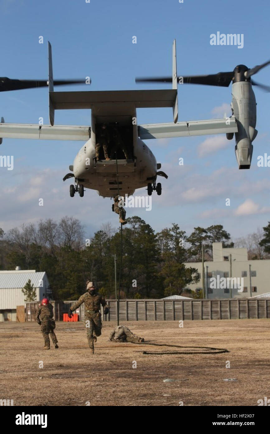 Marines conduct a fast-rope exercise out of an MV-22B Osprey during the ...