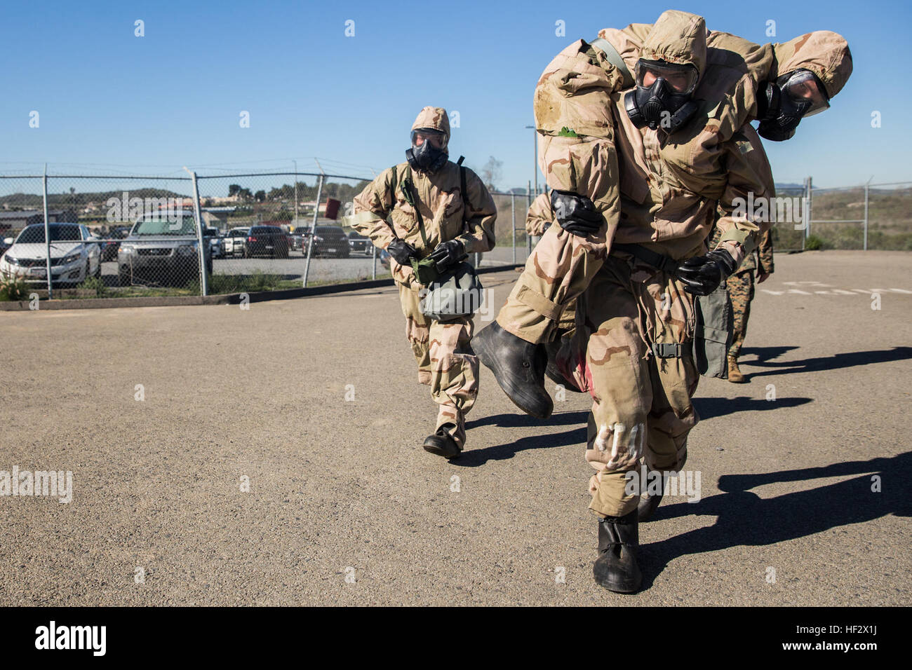 U.S. Marine Lance Cpl. Bryan Stratton carries a simulated casualty ...
