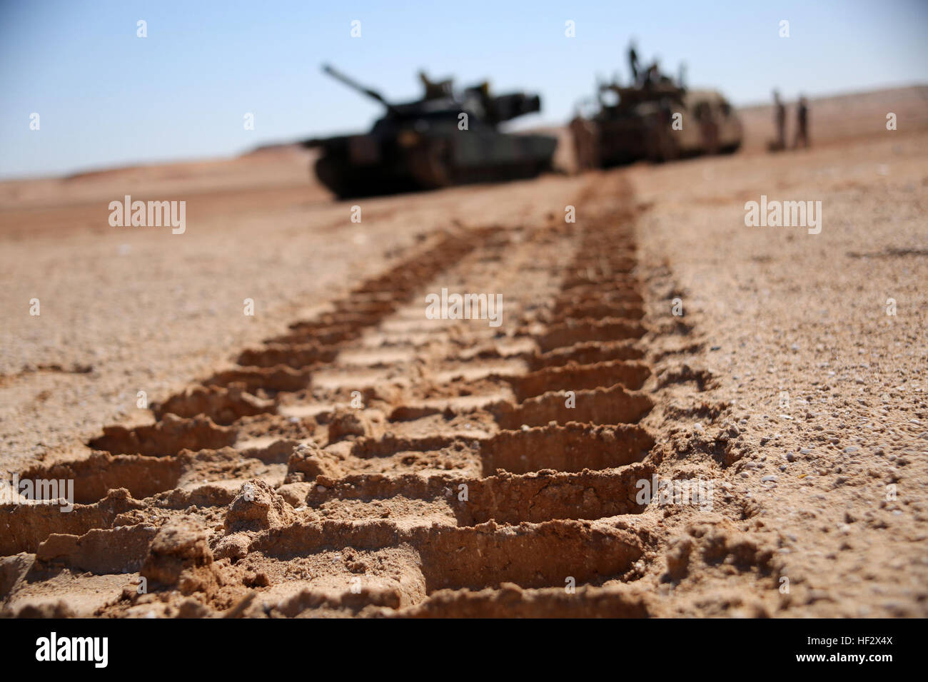 An M88A2 Hercules Armored Recovery Vehicle and M1A1 Abrams Main Battle ...