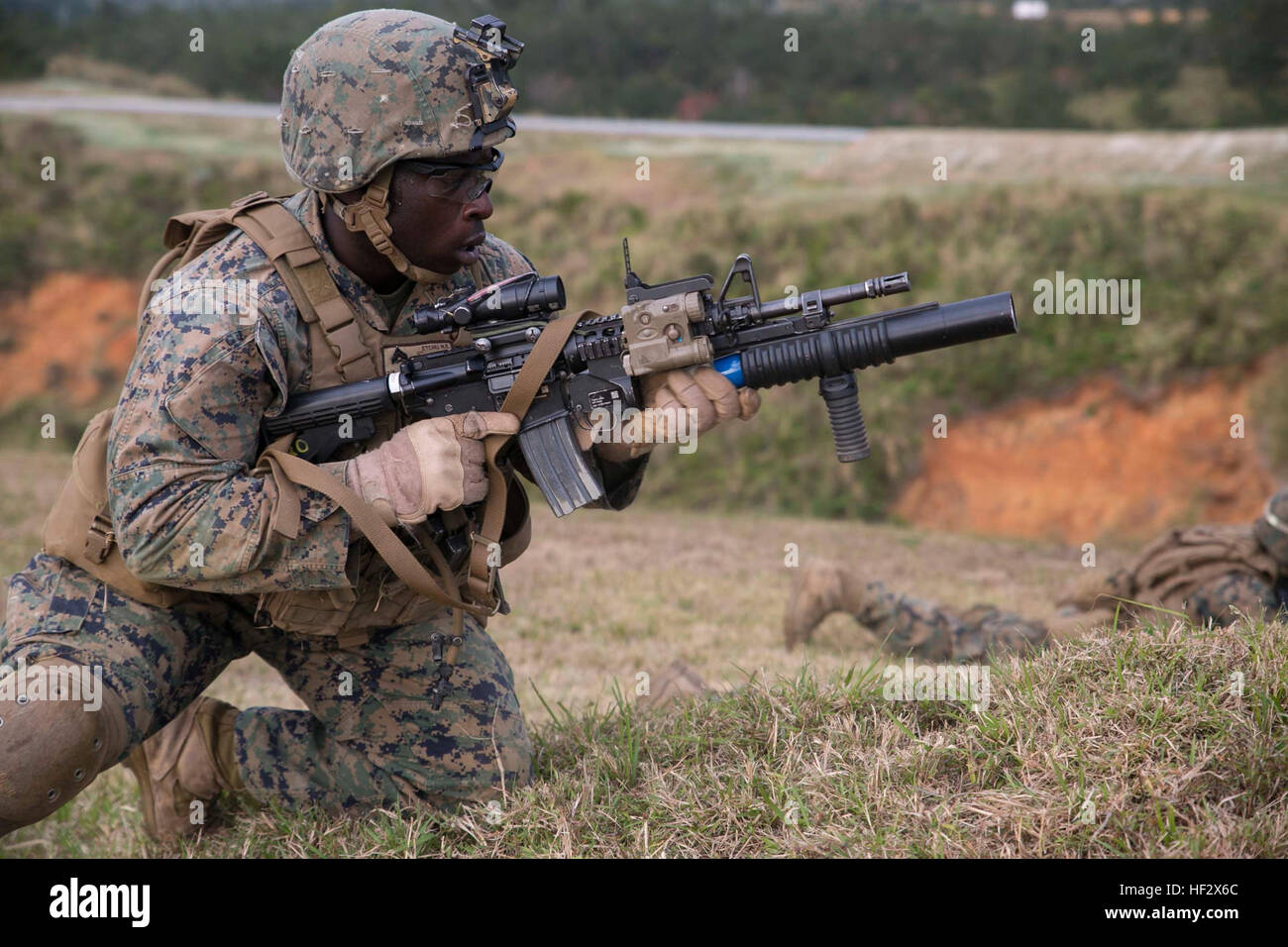 Cpl. Nehemie Etchu, from Allen, Texas, reloads his M203 40 mm grenade ...