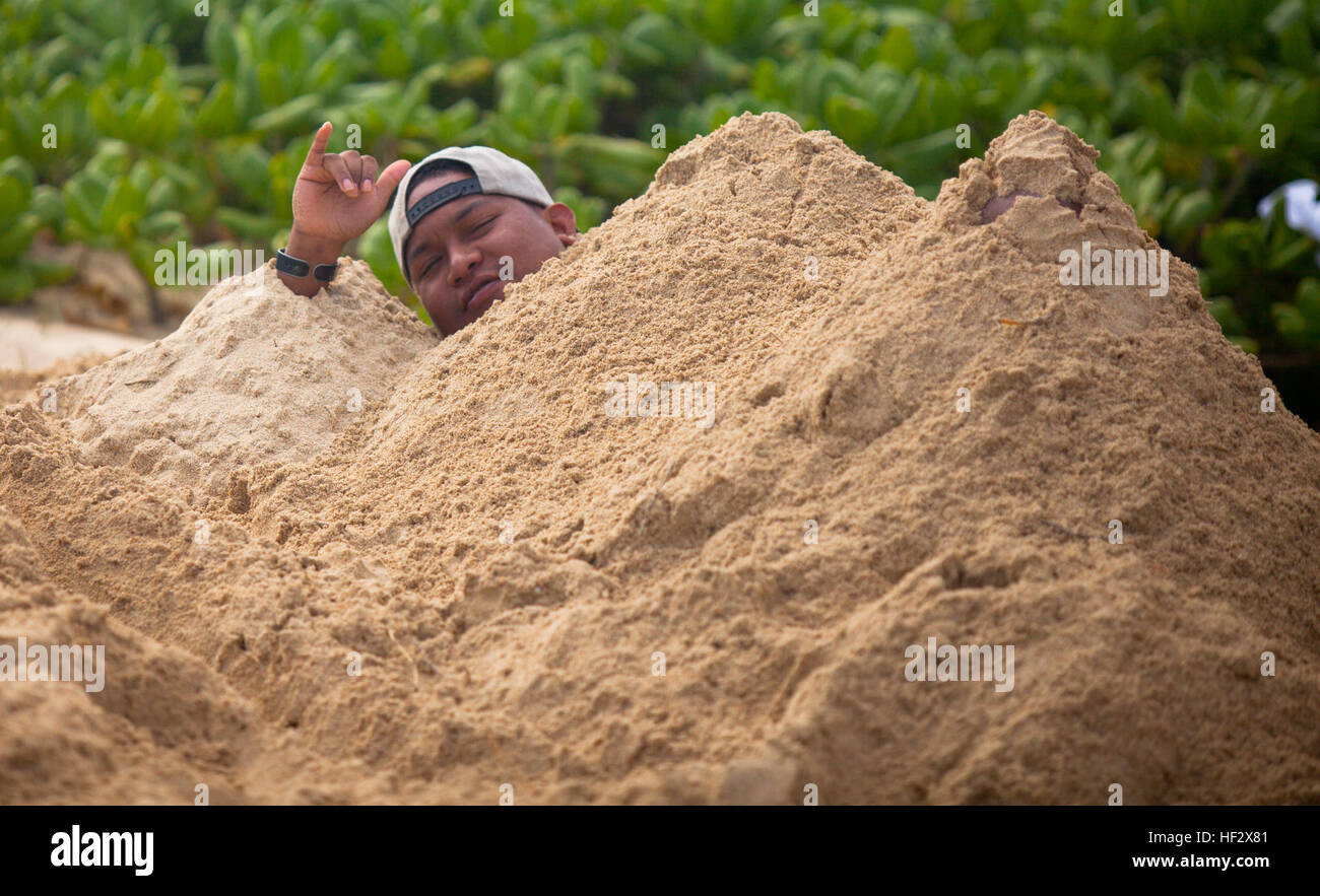 U.S. Marine Joseph Reyes poses for a photo while supporting the ...