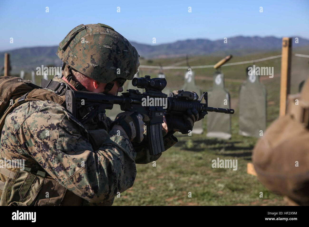 U.S. Marine Staff Sgt. Peter Pearson engages his target during combat ...