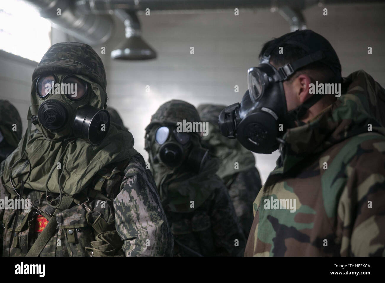 U.S. Marine Sgt. Byron M. Solano, right, inspects that the ROK Marines ...