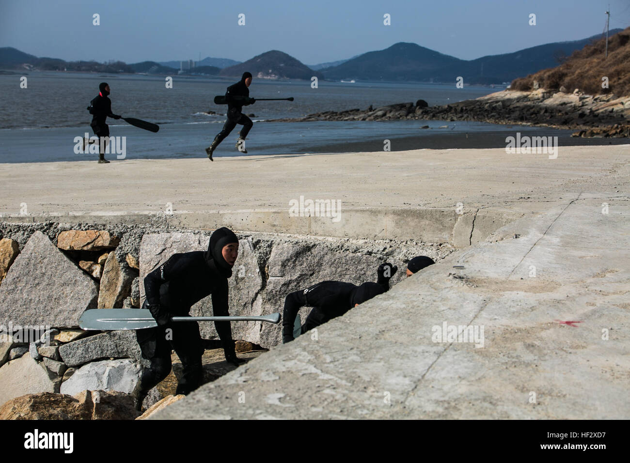 Republic of Korea Marines charge up a beachhead before seeking cover ...