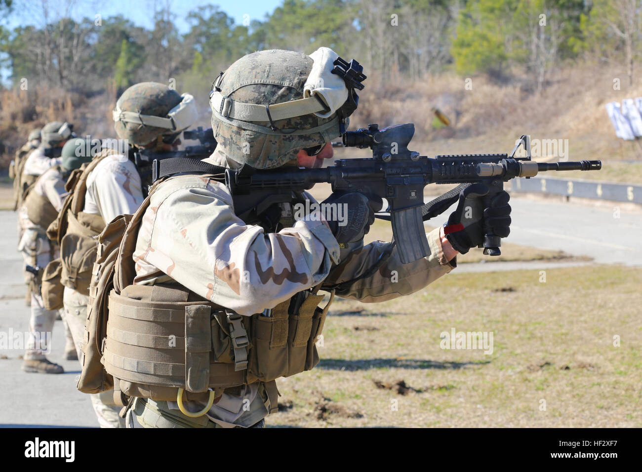 A Marine with 2nd Combat Engineer Battalion, 2nd Marine Division, fires ...