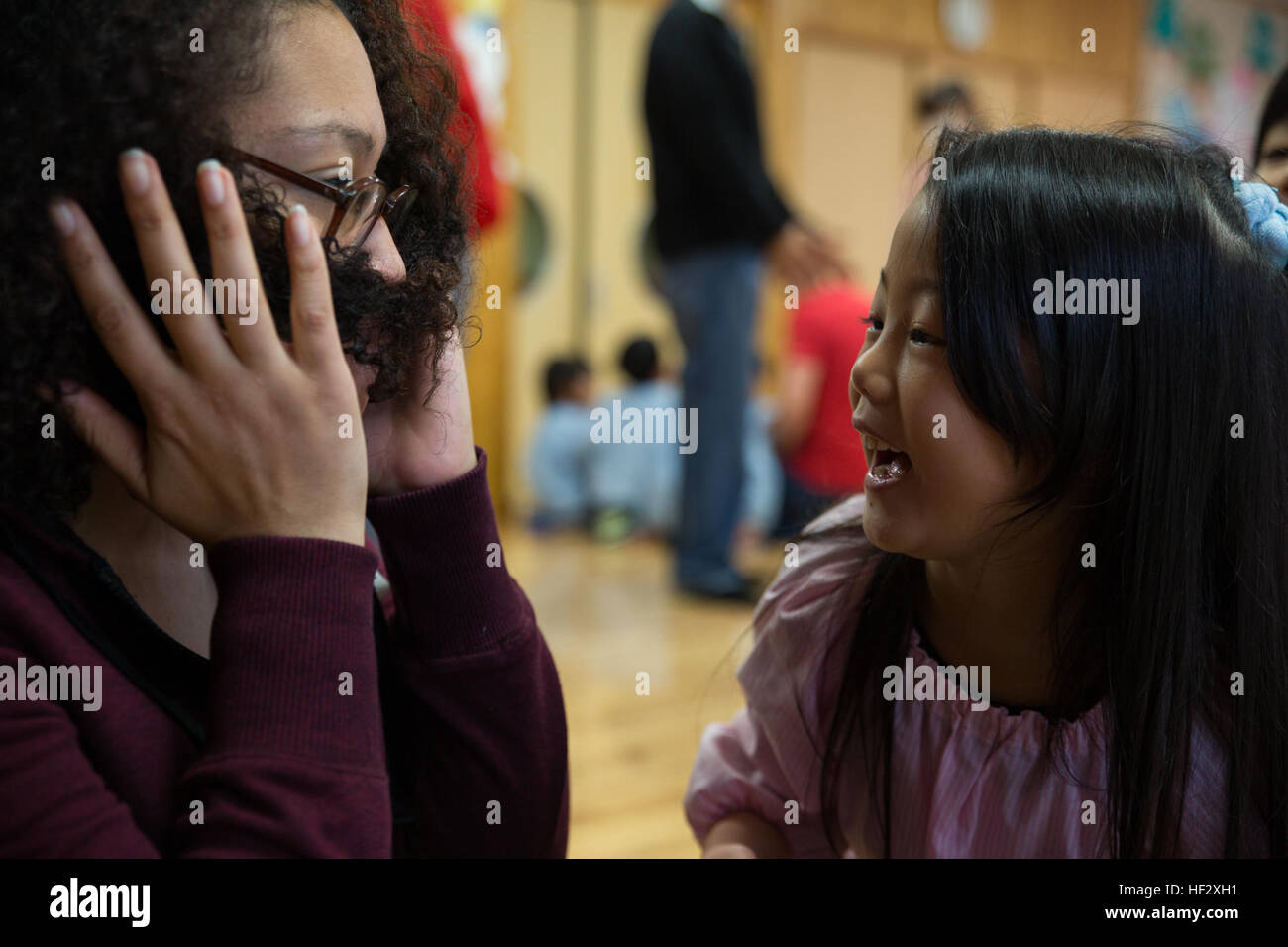 Volunteers interact with the students at Josho Hoikuen in Iwakuni City ...