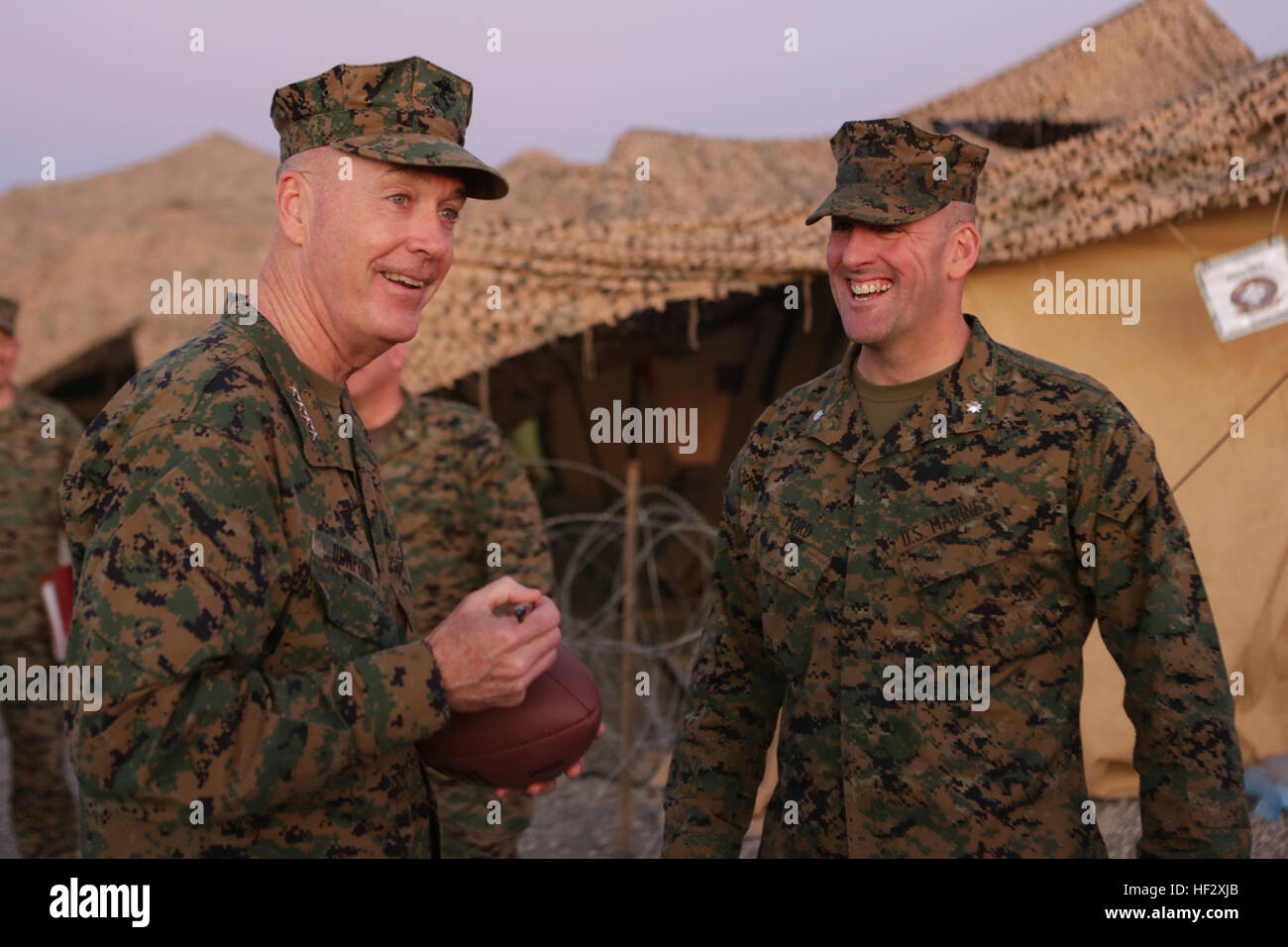 Commandant of the Marine Corps Gen. Joseph F. Dunford, Jr., left, signs ...