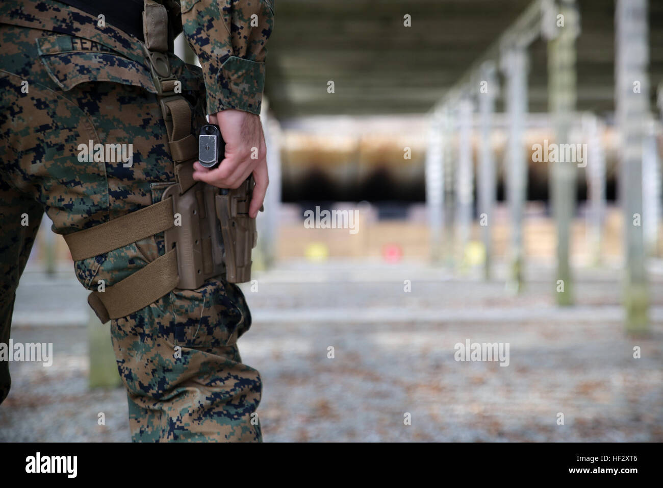 A Marine with 2nd Combat Engineer Battalion, 2nd Marine Division, gets ...