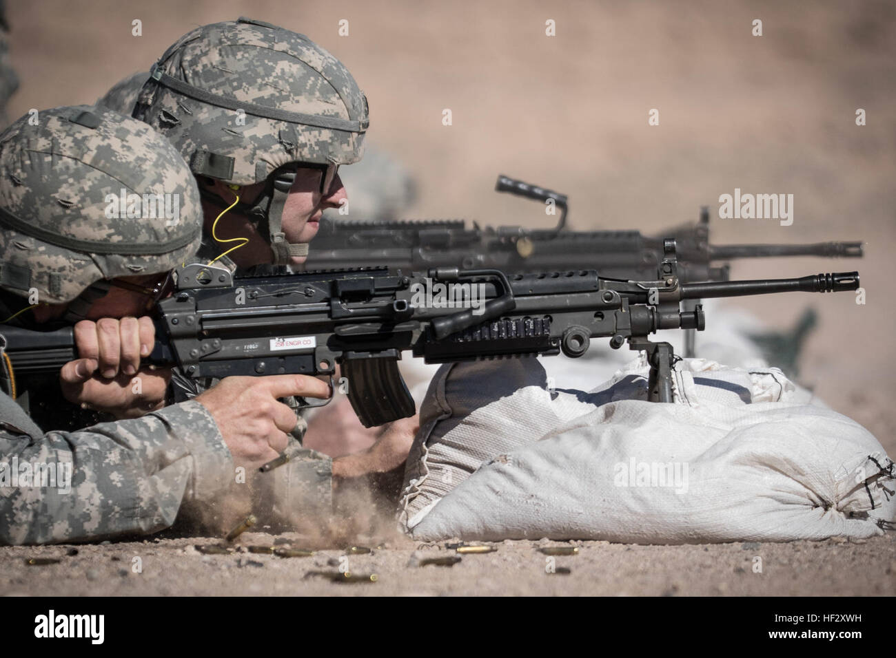 Army Sgt. David Caesar, an avionic sergeant, fires an M 249 squad ...