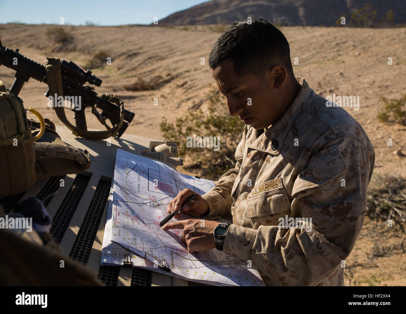 Staff Sgt. Absalon A. Cabrera plots points on a map to designate the ...