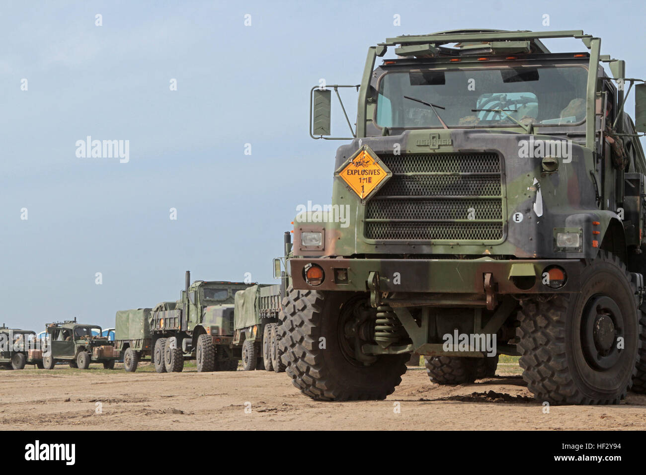 U.S. Marine Corps Vehicles are staged for loading onto a U.S. Navy ...