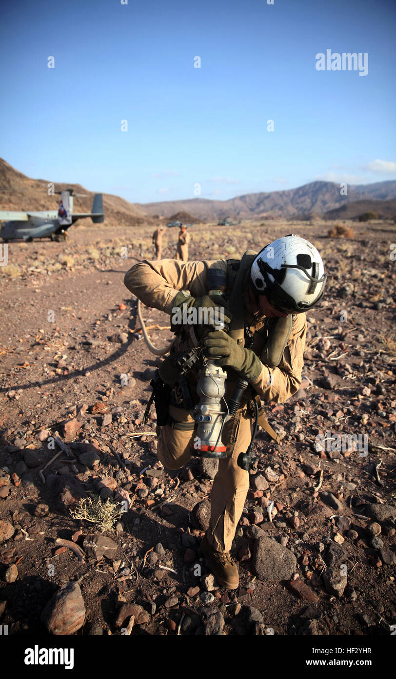 An MV-22B Osprey crew chief from Marine Medium Tiltrotor Squadron 365 ...