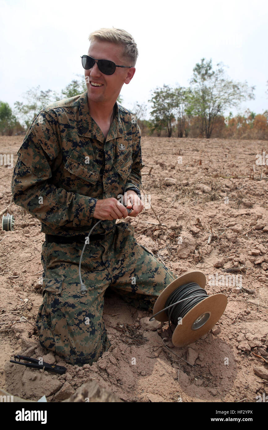 Staff Sgt. Nathan M. Peterson prepares to detonate unexploded ordnance ...