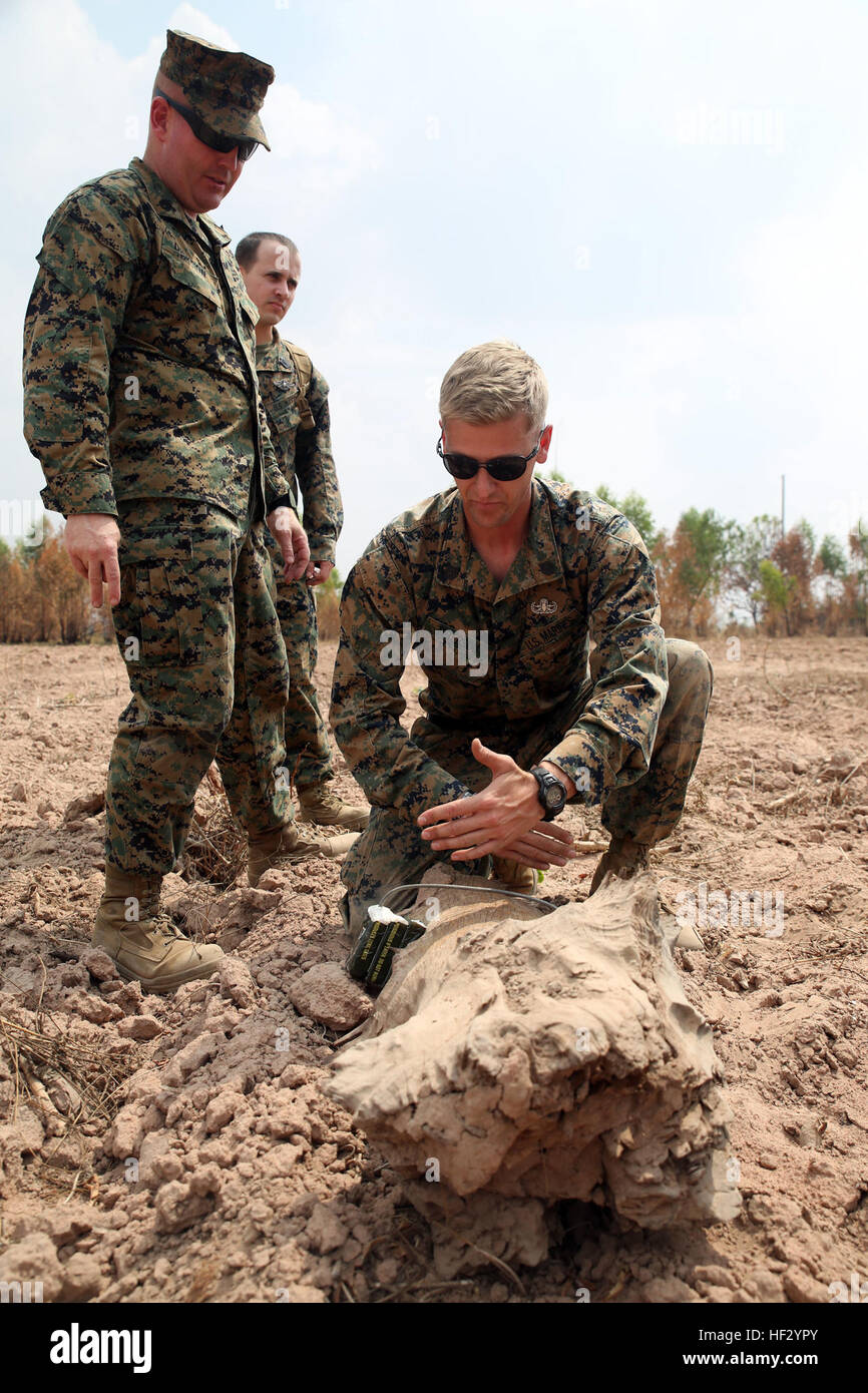 Staff Sgt. Nathan M. Peterson prepares to detonate unexploded ordnance ...