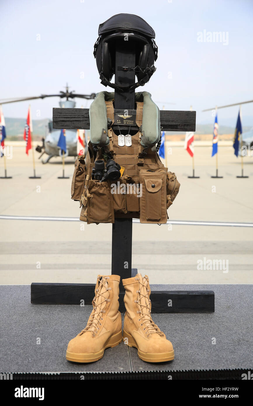 A battlefield cross stands in memory of Capt. Adam C. Satterfield, a UH ...