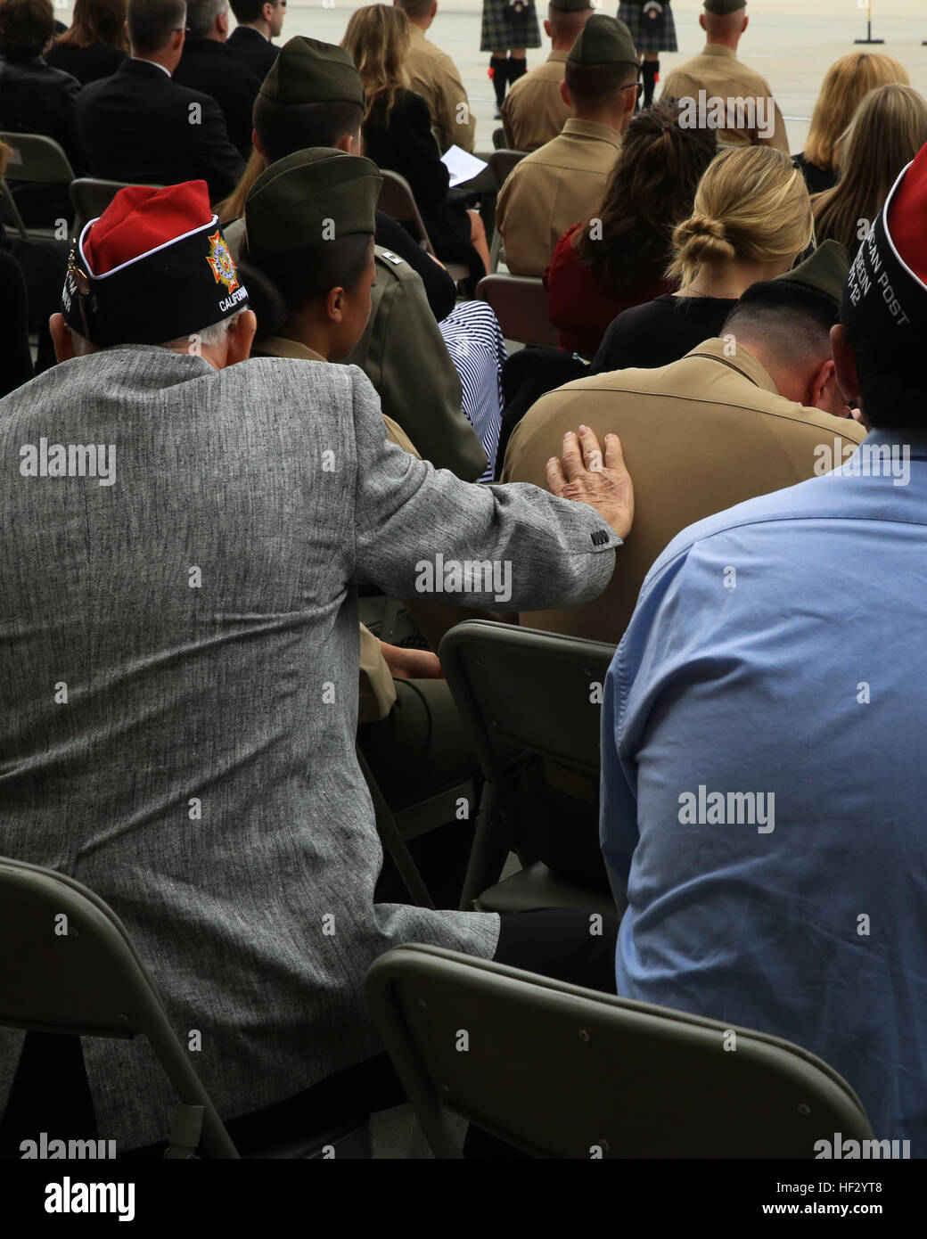 A Vietnam veteran comforts a U.S. Marine at the memorial service of Maj ...