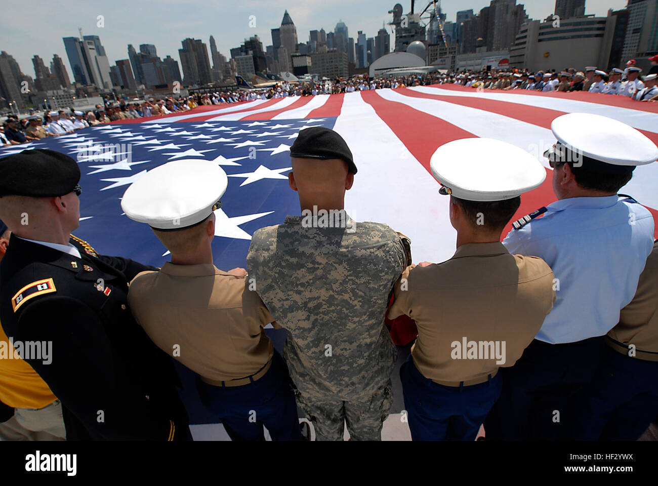 Members of the Fleet Week flag detail unfurl a U.S. flag during a ...