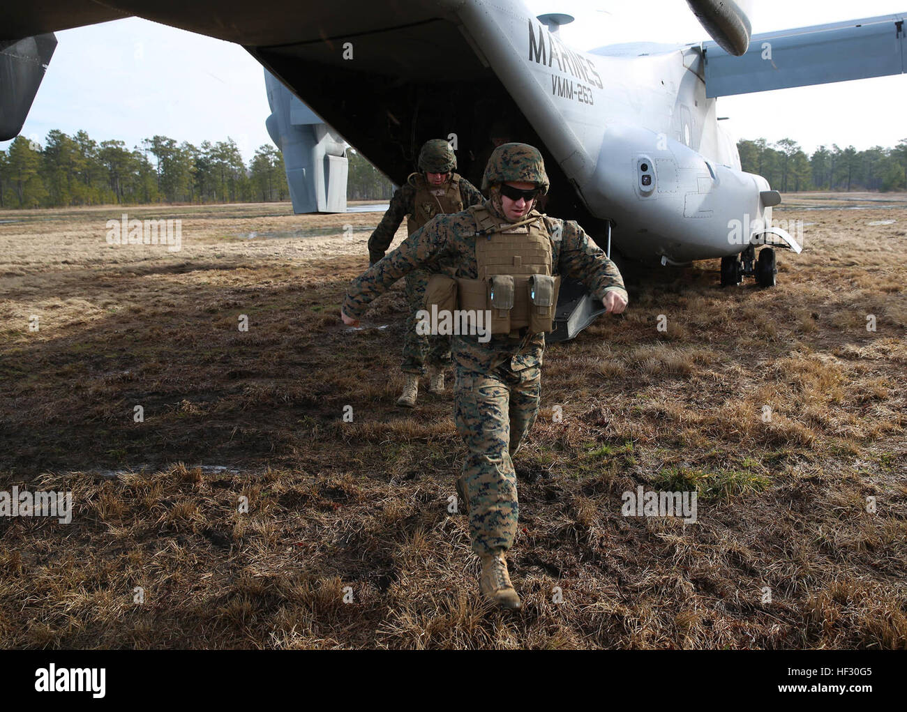 U.S. Marines with the 22nd Marine Expeditionary Unit exit an MV-22 ...