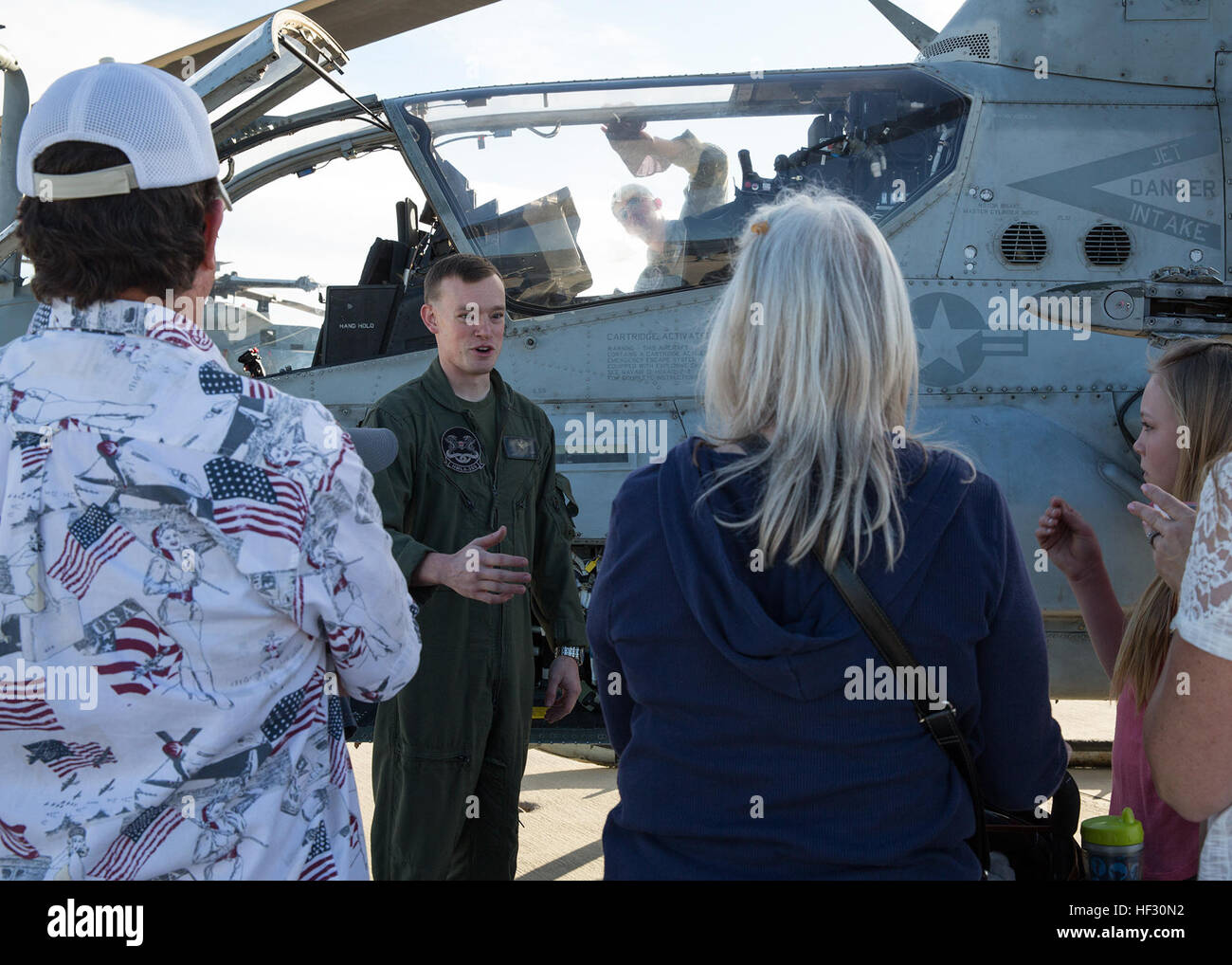Airshow goers interact with a Marine from Marine Light Attack ...