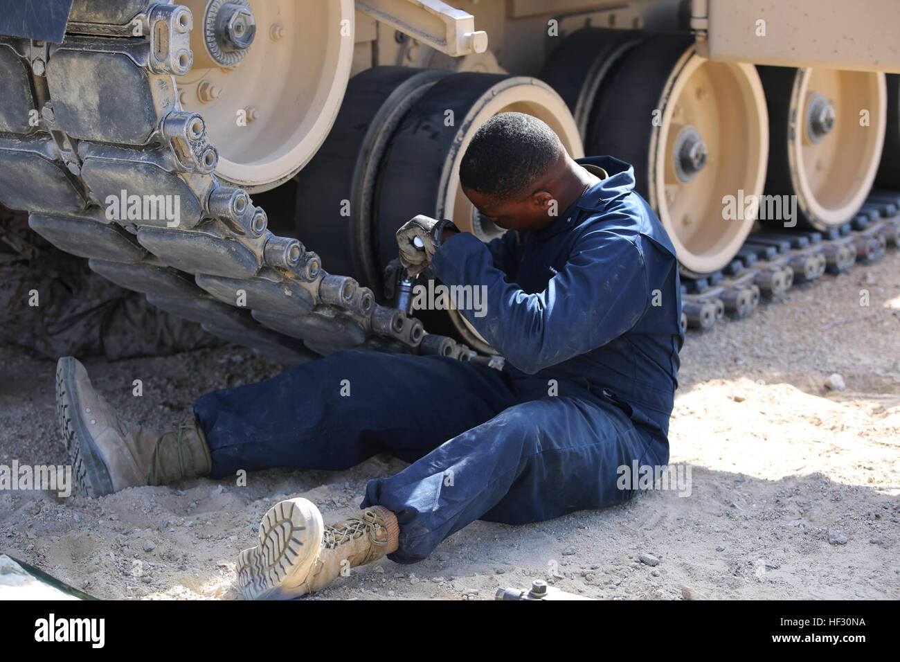 A Marine tank crewman operates an M1A1 Abrams tank during training at ...