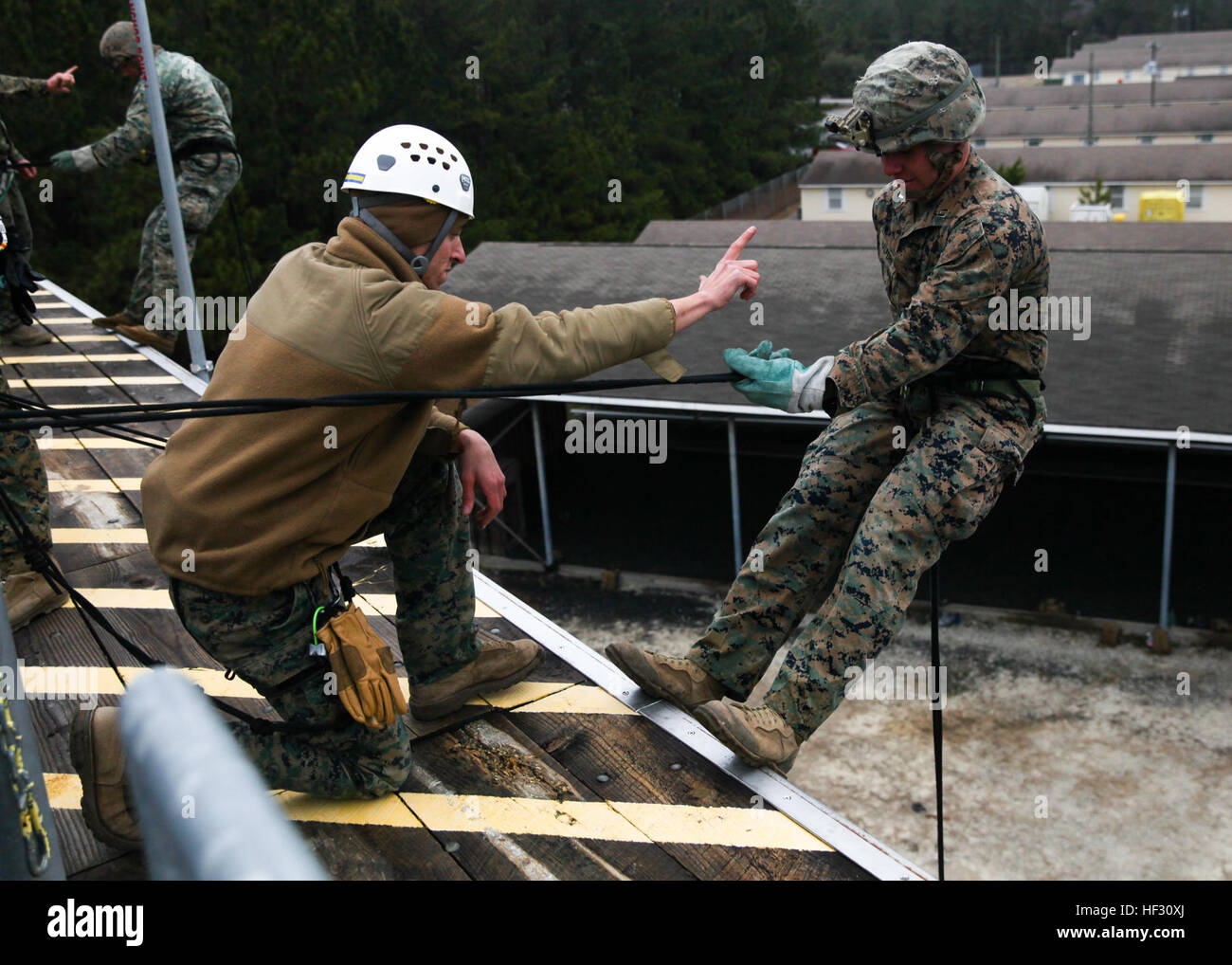 An instructor coaches his student on the proper way to begin descending ...