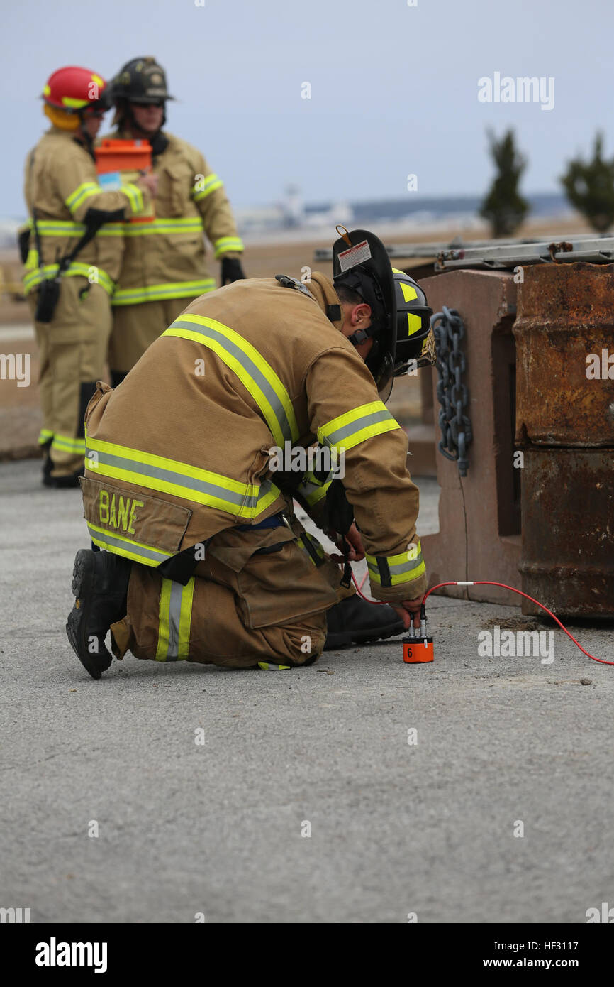 Firefighters and first responders use a Delsar Life Detector device to ...