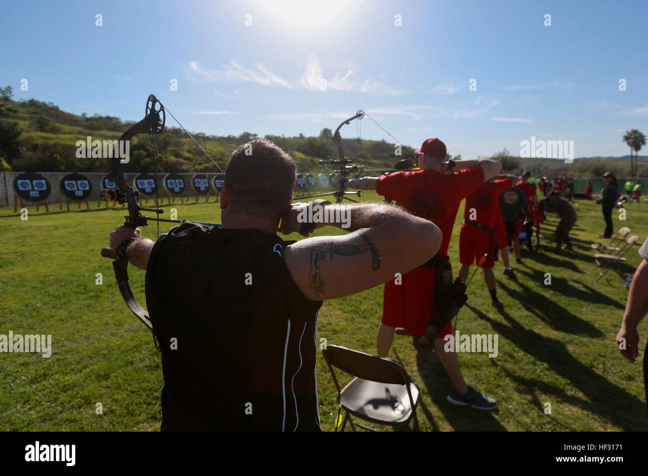 Gavin Bolger, a British Royal Marine Commando draws his bow and takes ...