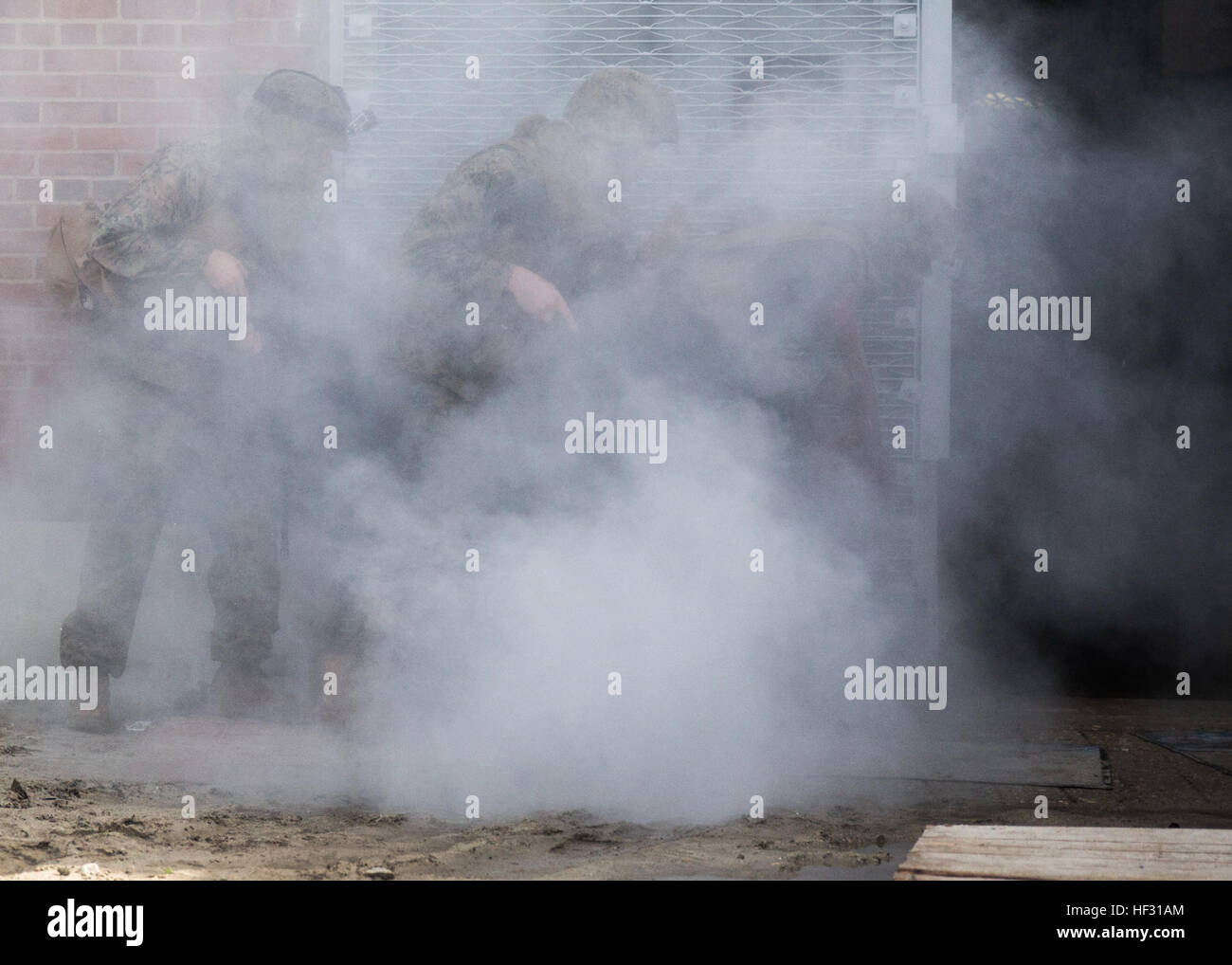 With a cloud of smoke and a loud bang, a simulated bomb detonates close ...