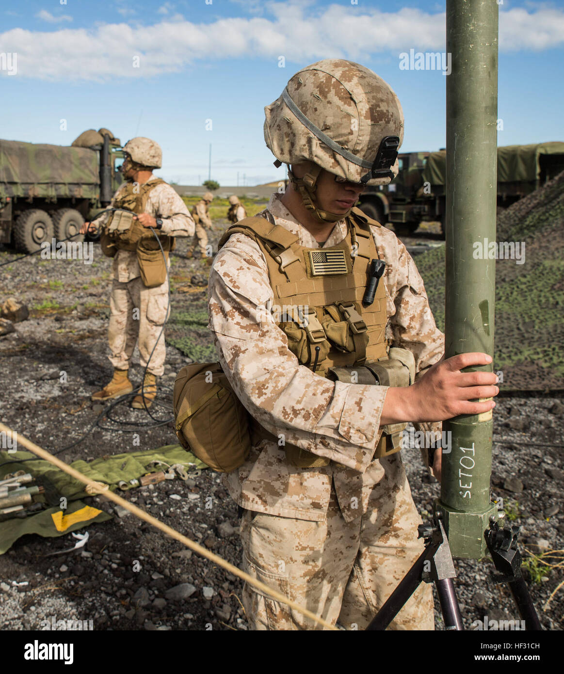 Cpl. Calvin V. Montgomery breaks down a communication antennae to move ...