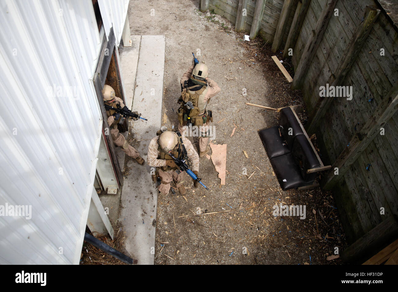 A fire team with 2nd Force Reconnaissance Detachment 6 moves outside ...