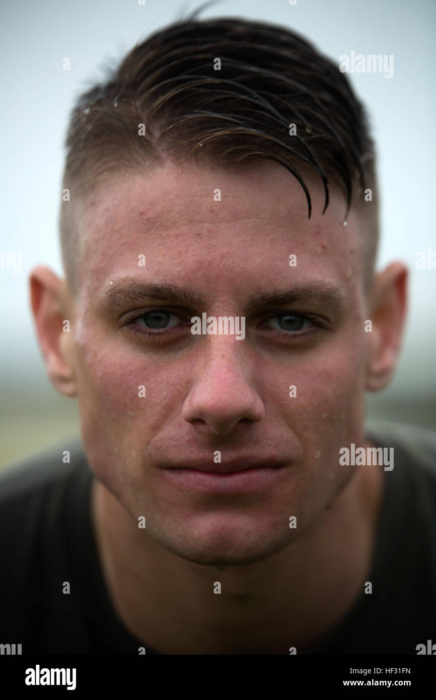 Lance Cpl. Ryan Reuscher poses for a photo before being sprayed with ...