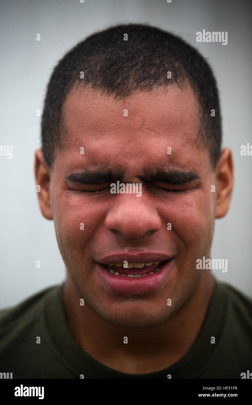 Lance Cpl. Anthony Bello poses for a photo after being sprayed in the ...