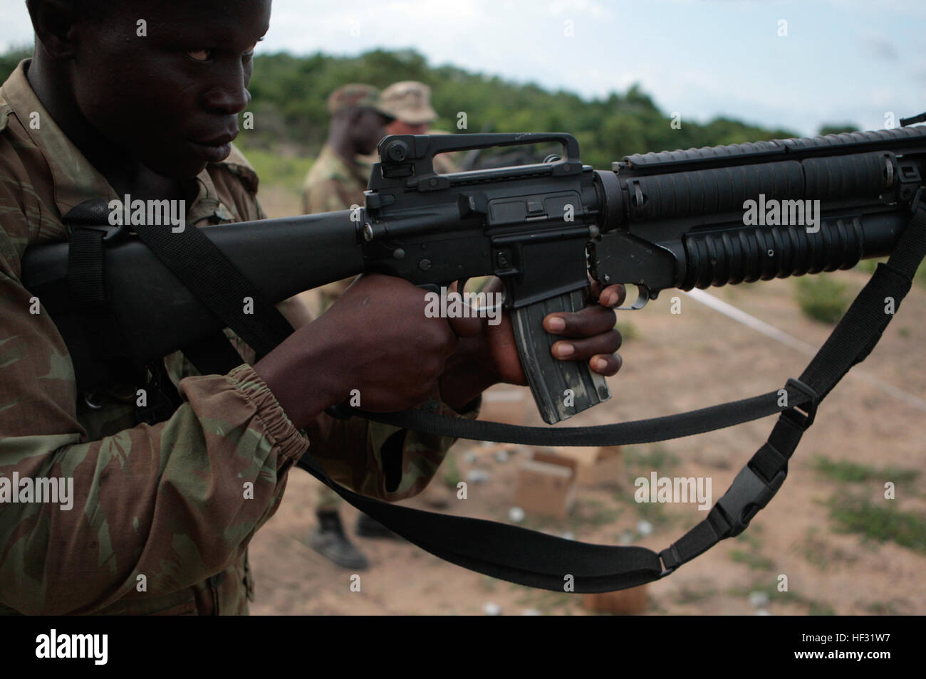 A soldier from the 2nd Company, Beninese army fires an M-203 grenade ...