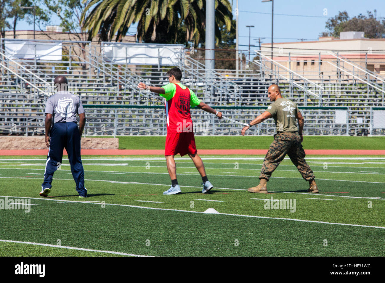 Athletes do warm up exercises at the 2015 Marine Corps Trials. The ...
