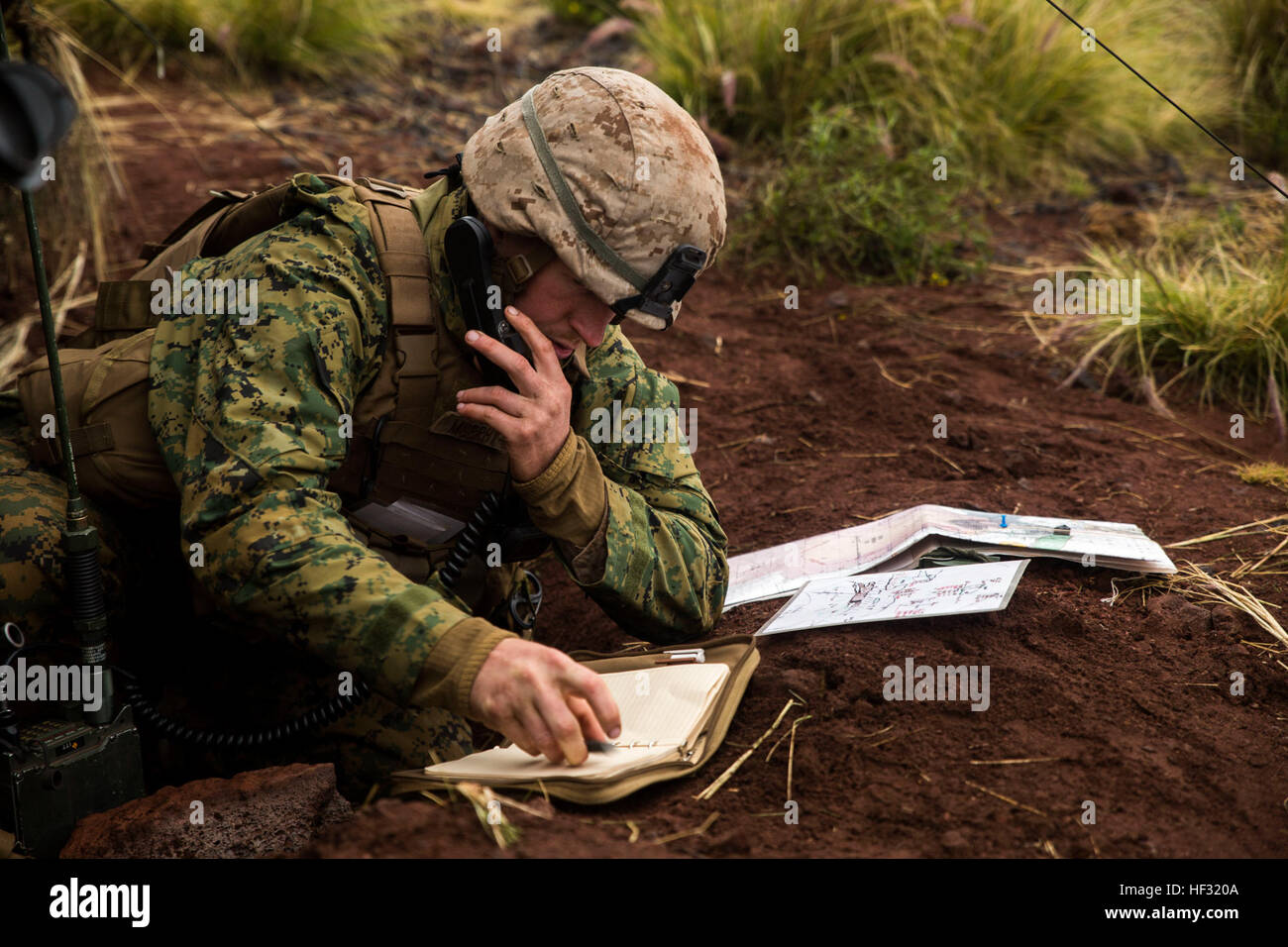 First Lt. Steven M. Murphy makes a call for fire over the radio, giving ...