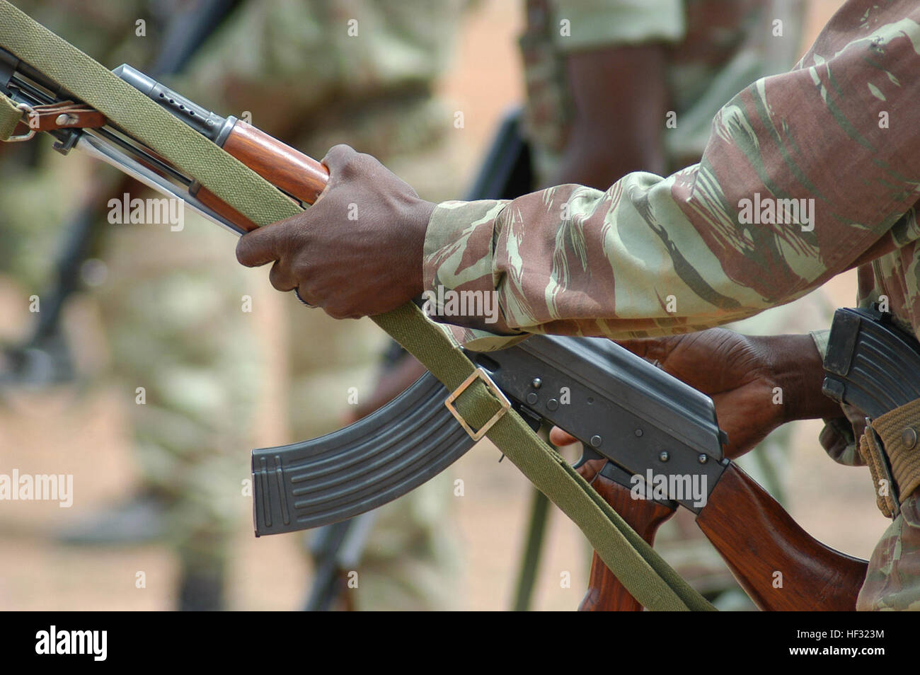 BEMBEREKE, Benin (June 16, 2009) - A Beninese soldier racks his weapon ...