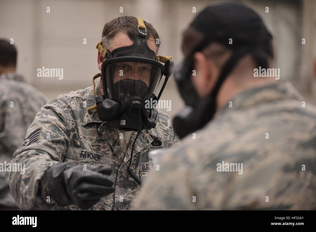 Staff Sgt. Jeffrey Fancher hands off a sample of an unidentified ...