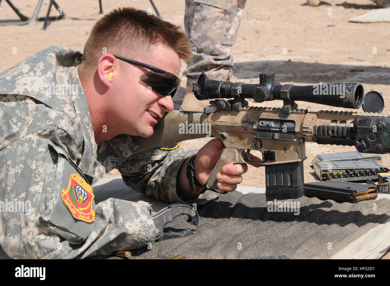 U.S. Army Sgt. Kenneth J. Butler, of Braintree, Mass., fires a 50 ...