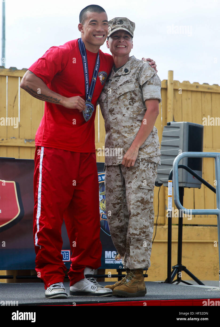 Cpl. Joseph Logue, an athlete from WWBn-East, receives a silver medal ...