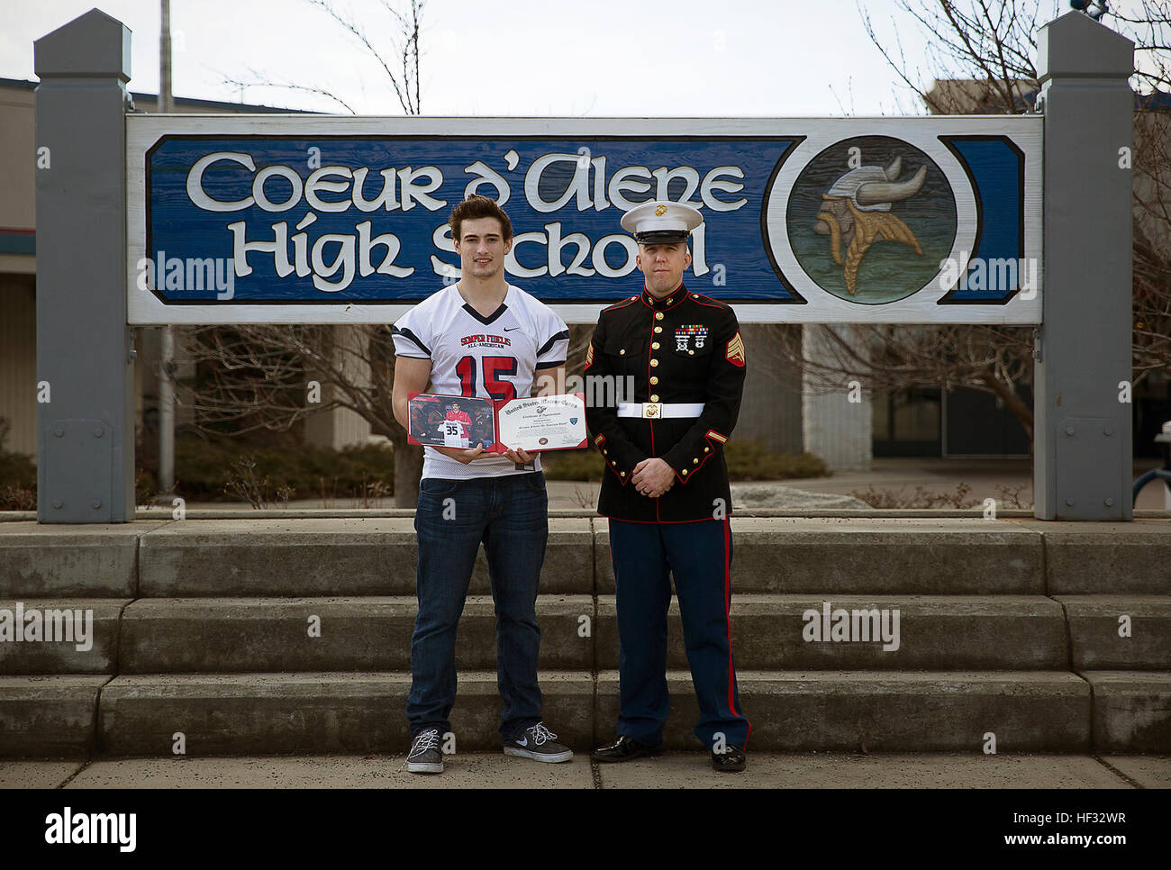 Sgt. Alex Angle, a Marine recruiter in Hayden, Idaho, congratulates ...