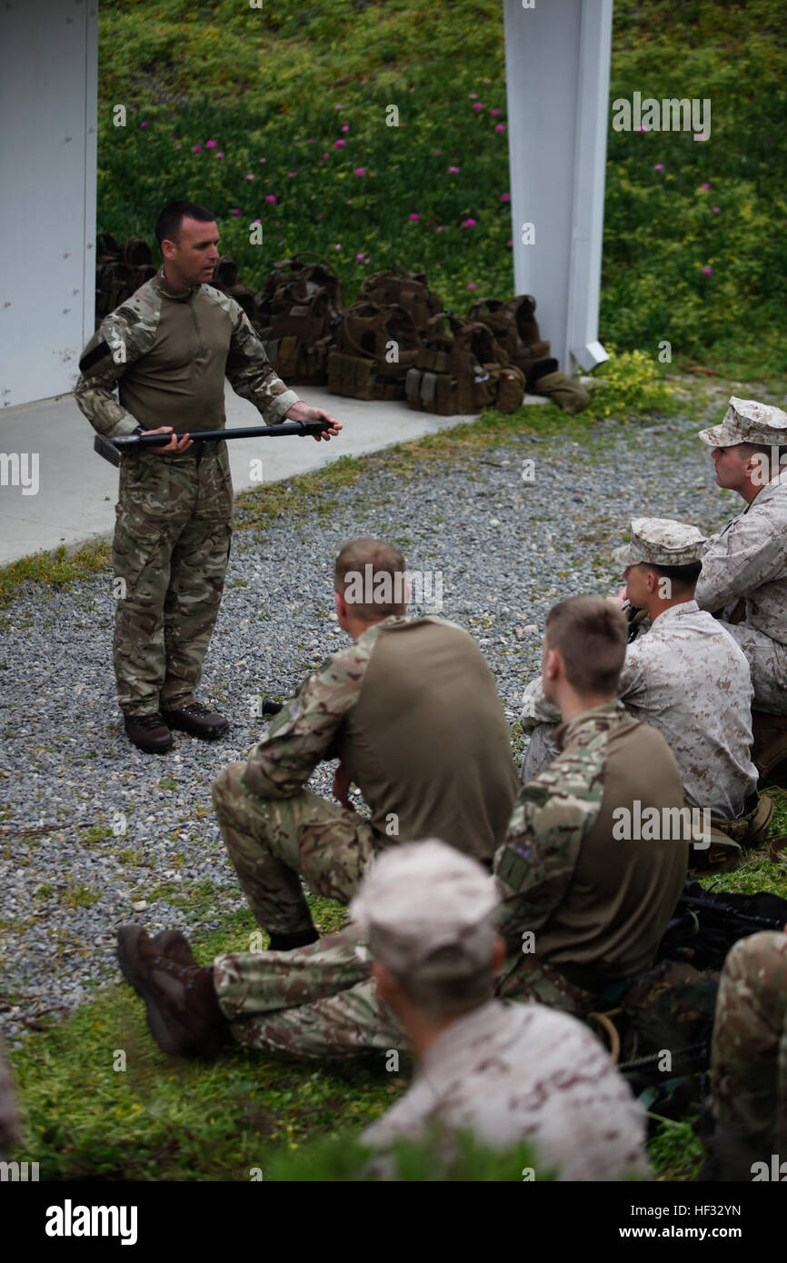 British Royal Marine Commandos Cpl. Steven Madison demonstrates tools ...